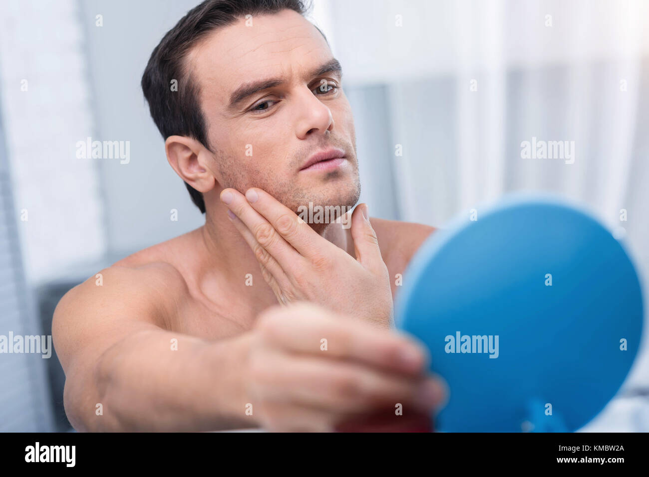 Magnetic confident man observing results Stock Photo - Alamy