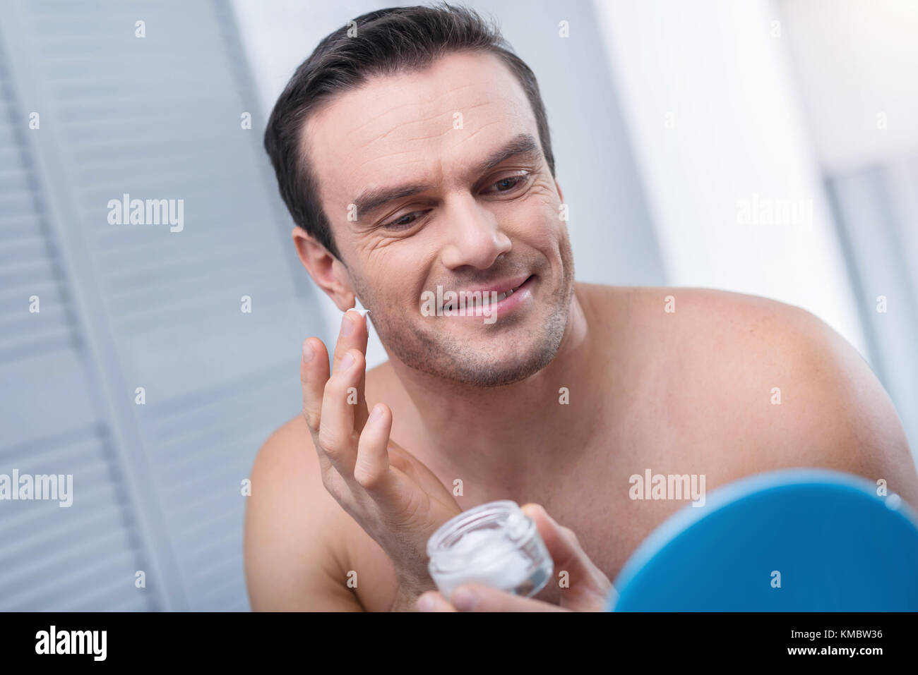 Vigorous appealing man taking care of himself Stock Photo - Alamy