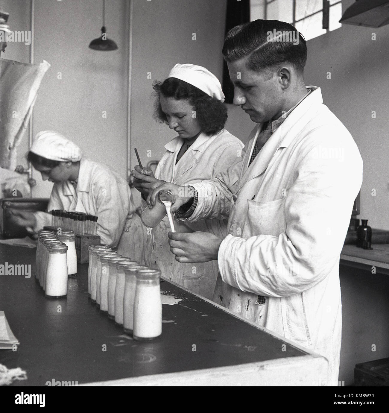1950s, historical, male and female lab technicians in white coats ...