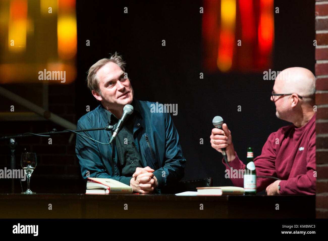 The German singer, musician and author Thees Uhlmann (L) reads loud ...