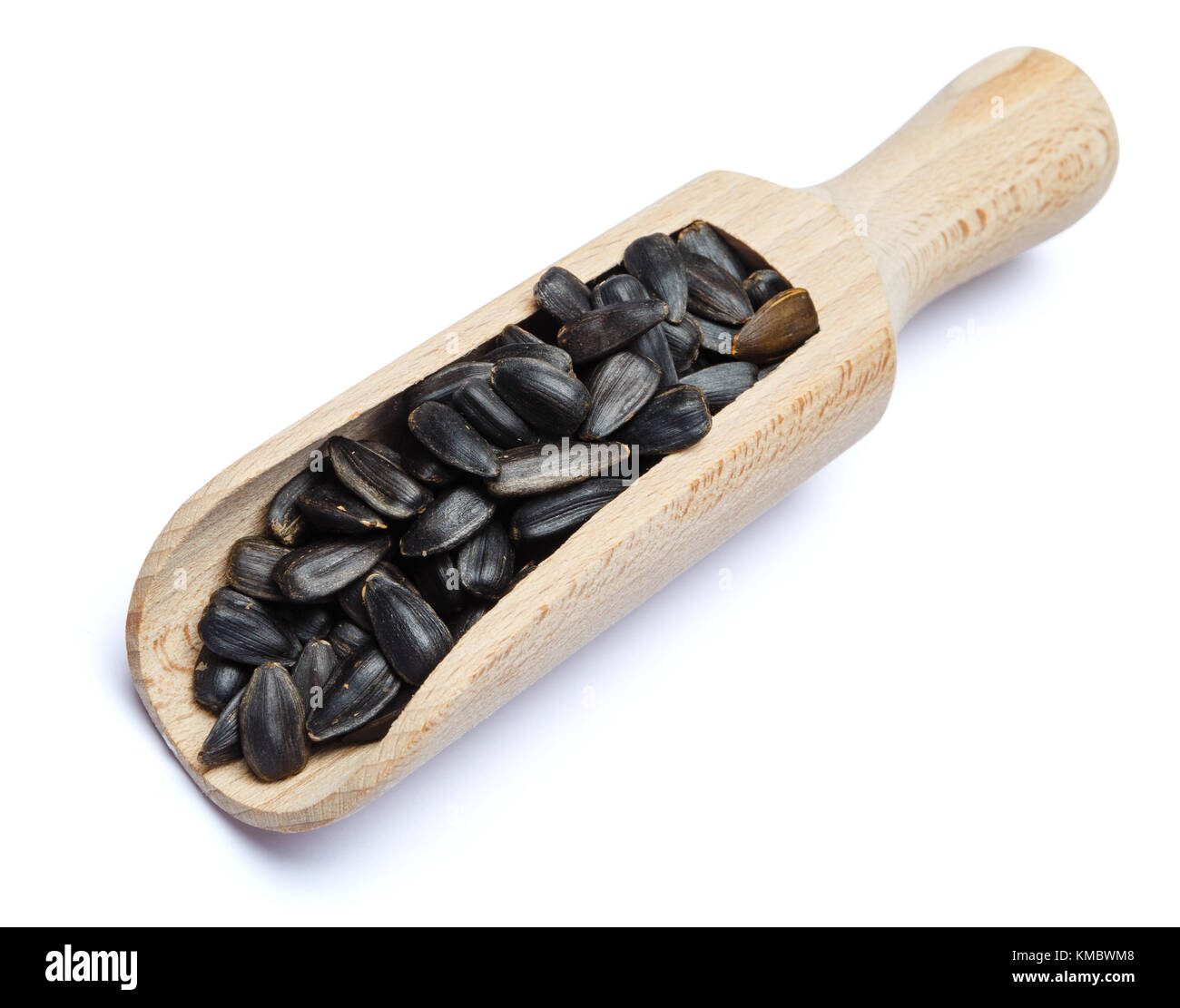 Scoop of sunflower seeds isolated on a white. Clipping path Stock Photo ...