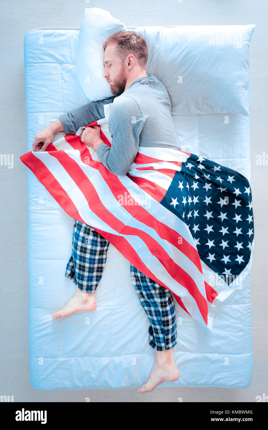 Handsome male person holding flag Stock Photo - Alamy