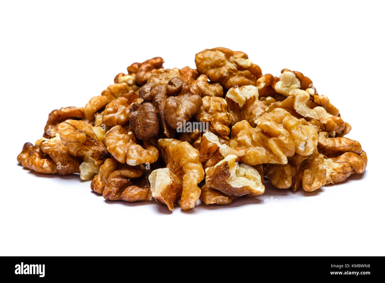 heap of shelled walnuts isolated on white background Stock Photo - Alamy