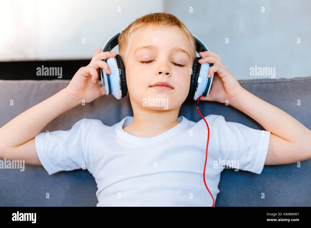Pleasant calm boy feeling relaxed Stock Photo - Alamy