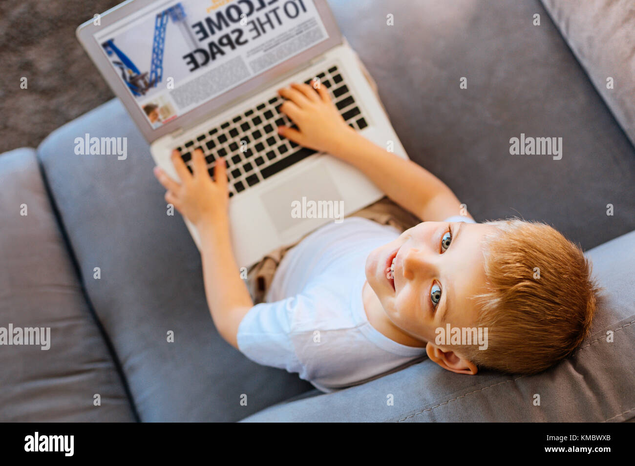 Top view of a cute young boy looking at you Stock Photo - Alamy