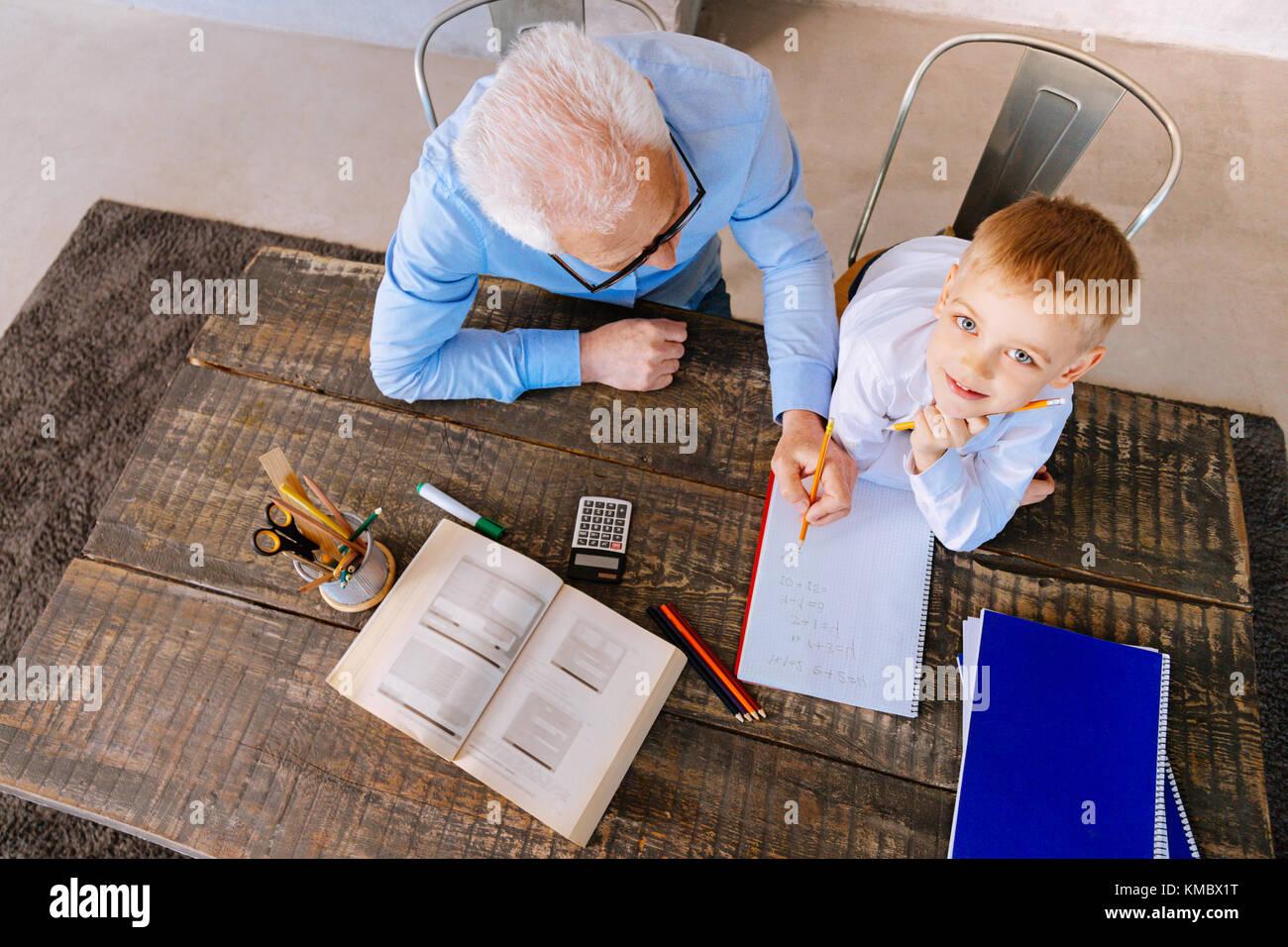 Smart nice boy doing his homework Stock Photo - Alamy