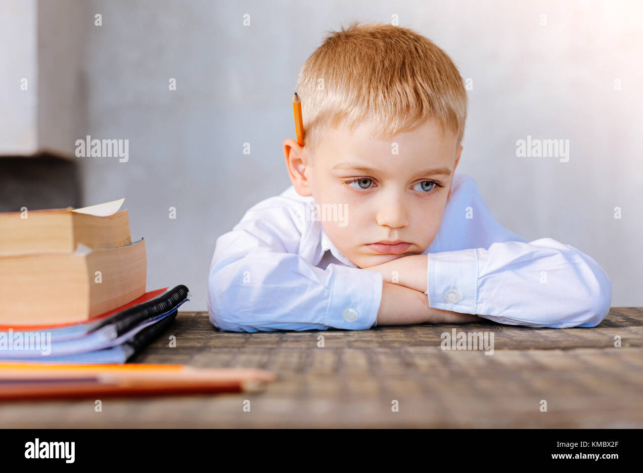 Serious smart boy thinking about his studying Stock Photo - Alamy