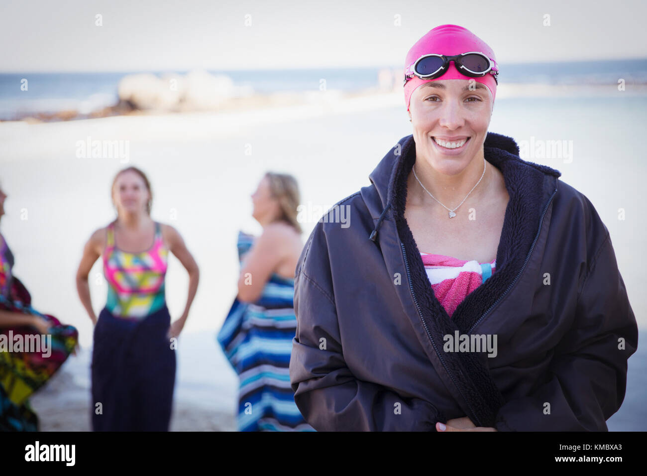 Portrait smiling, confident female open water swimmer Stock Photo - Alamy