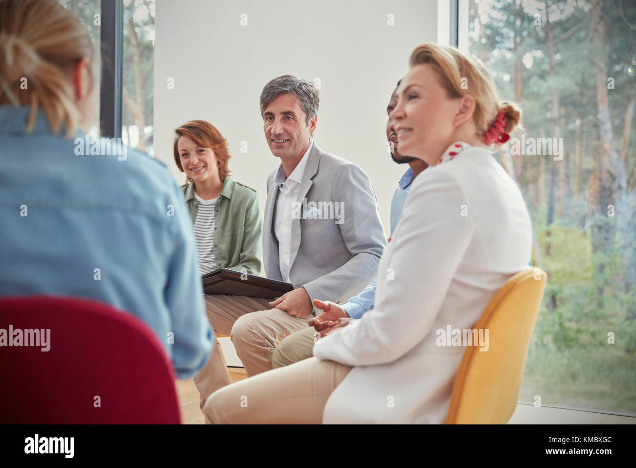 People listening in group therapy session Stock Photo - Alamy