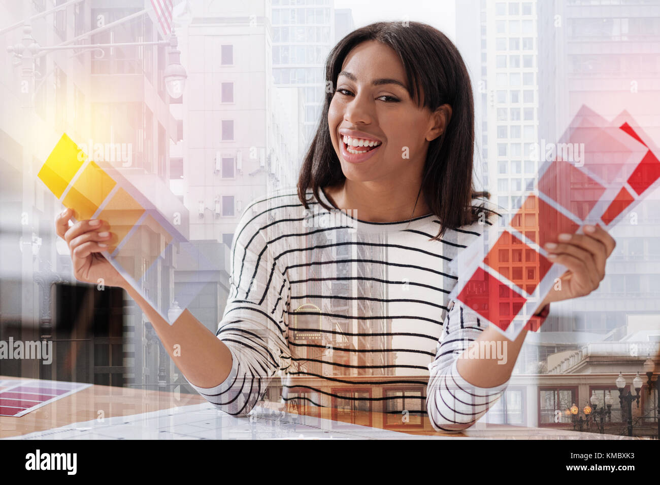 Delighted international engineer posing on camera Stock Photo - Alamy
