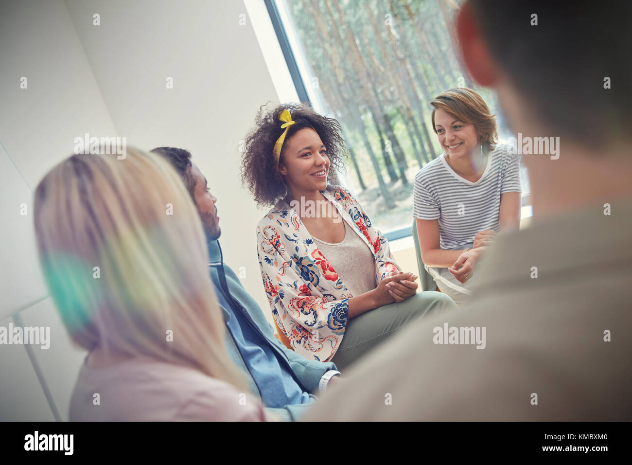 Woman talking in group therapy session Stock Photo - Alamy