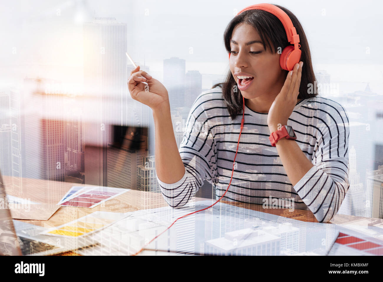 Joyful office worker listening to music Stock Photo - Alamy