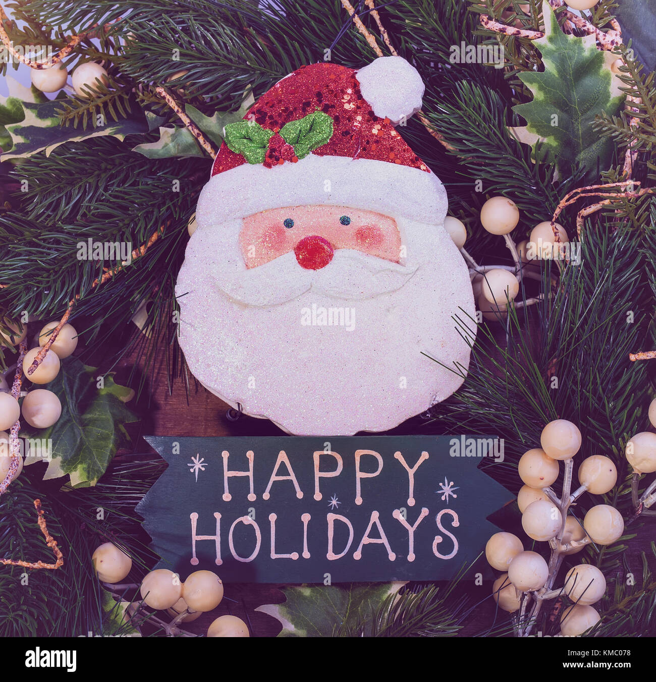 santa and word happy Holiday written on wooden background Stock Photo ...