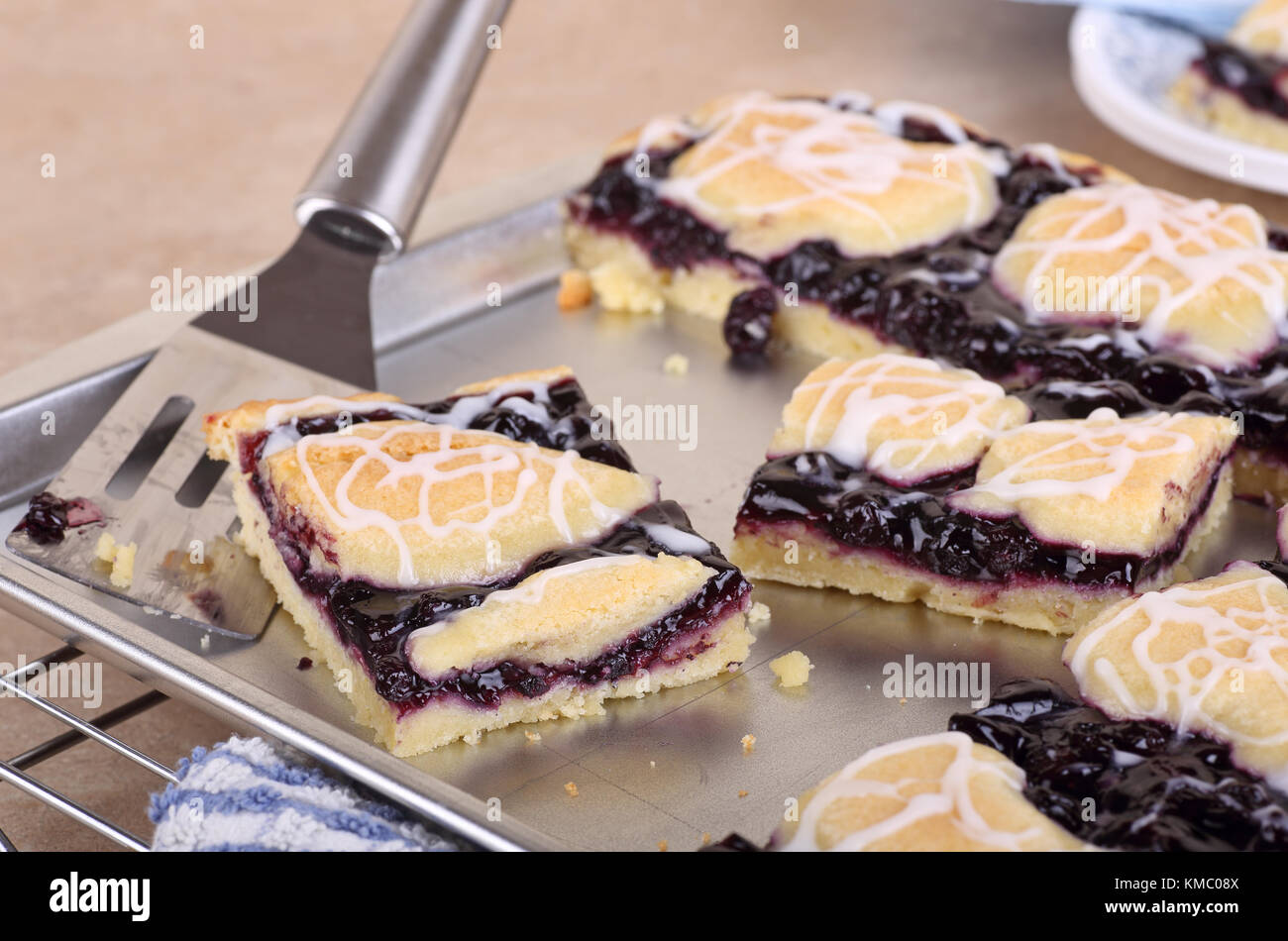 Sliced blueberry bars on a baking sheet Stock Photo - Alamy