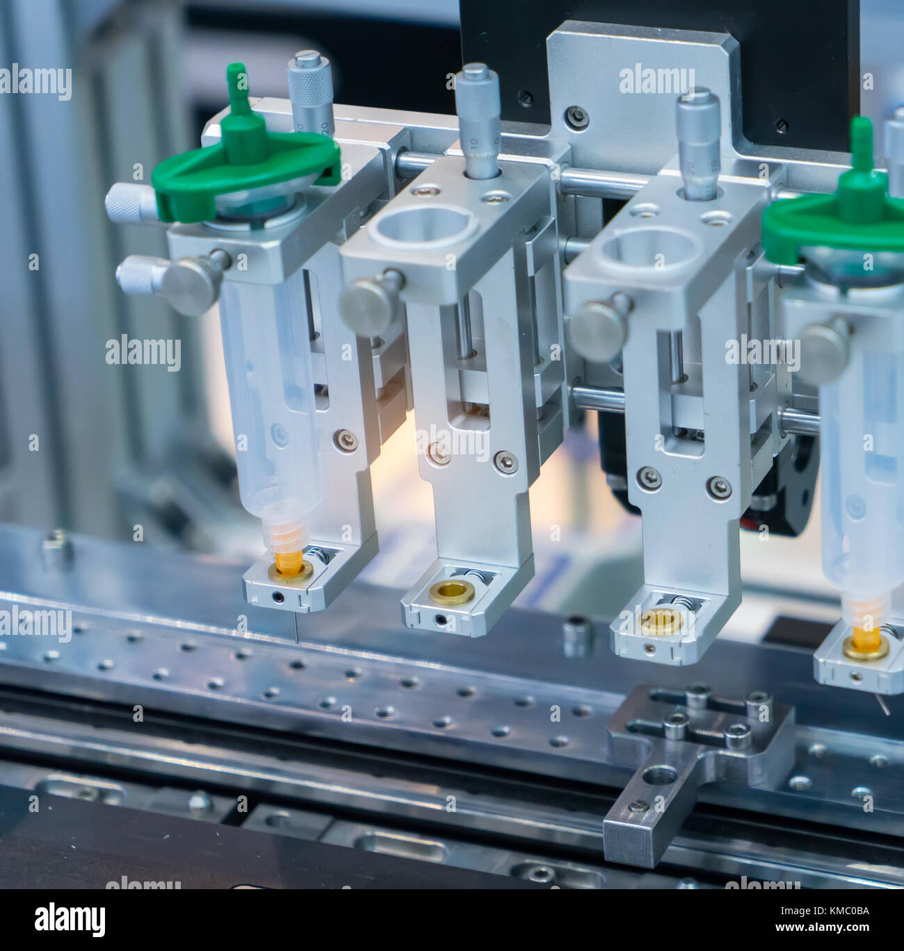 Robot holding glue syringe Injection Stock Photo - Alamy