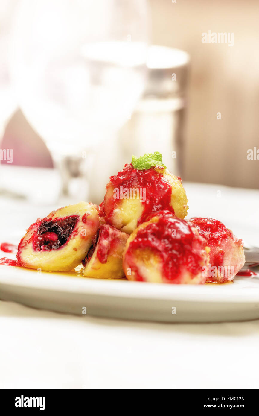 Traditional czech blueberry dumplings with raspberry coulis Stock Photo ...