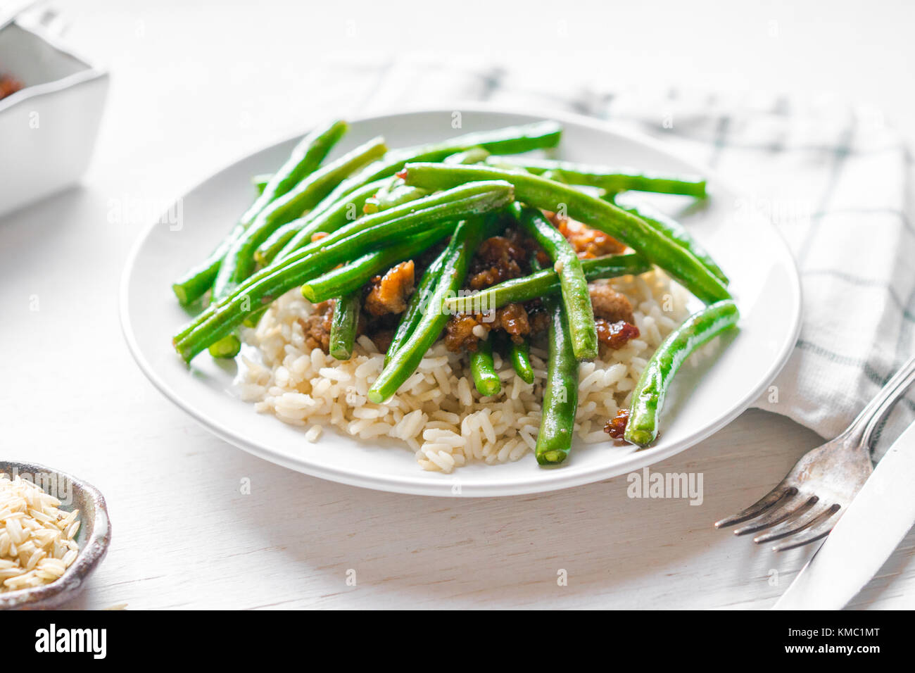 Meat with rice and green beans Stock Photo - Alamy