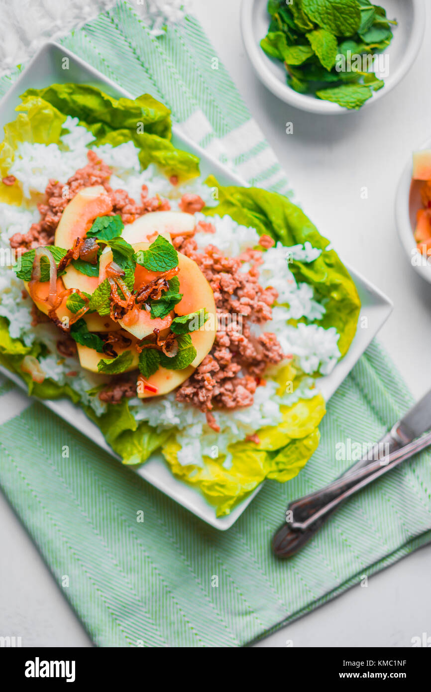 Meat with rice and papaya Stock Photo - Alamy