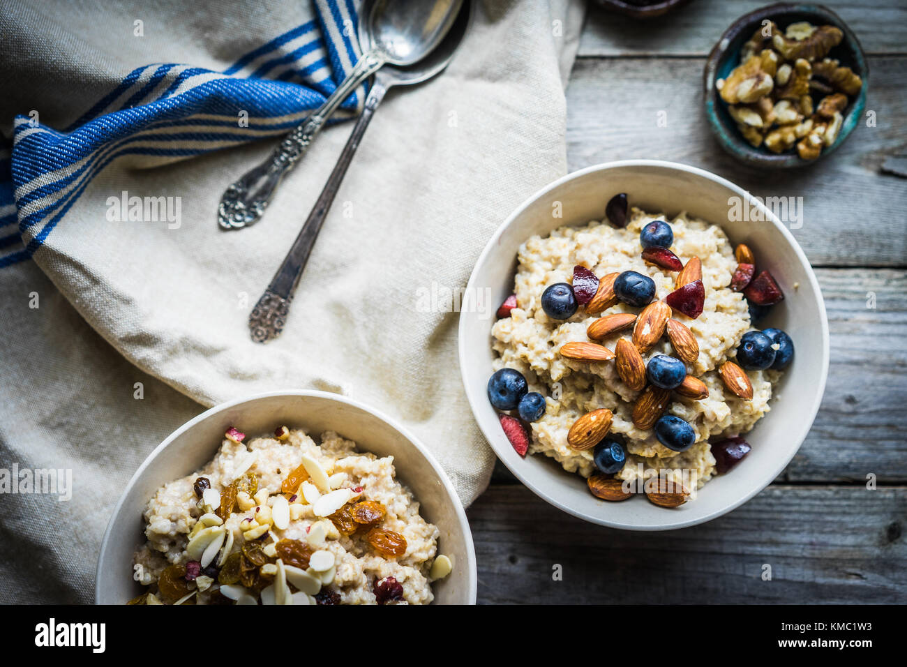 Oatmeal with berries and nuts Stock Photo - Alamy