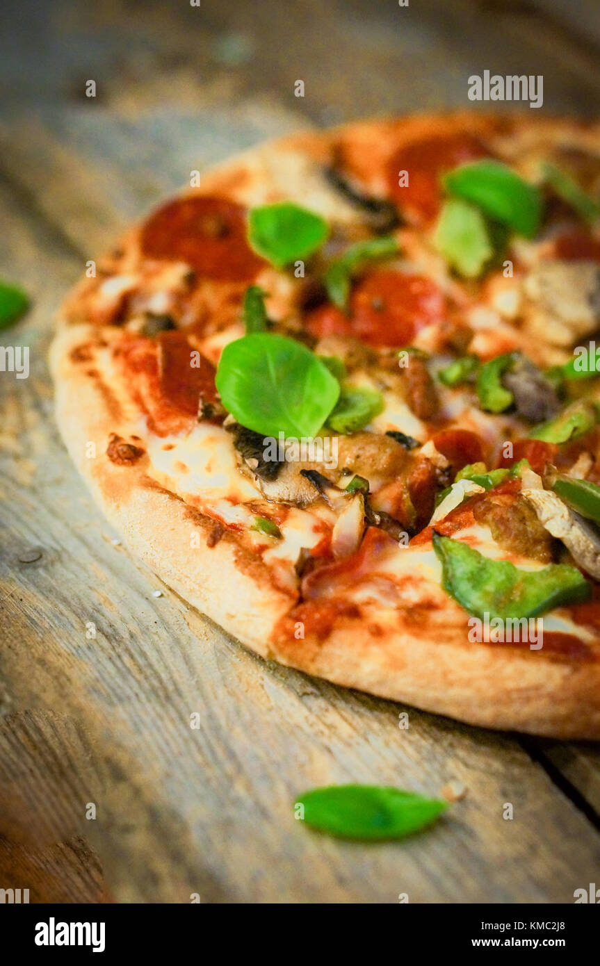 Sliced Home Made Pepperoni Pizza On Wooden Rustic Background Stock ...