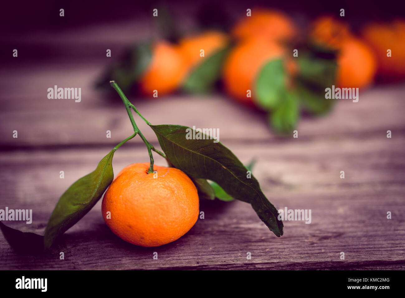 Tangerines on rustic background Stock Photo - Alamy
