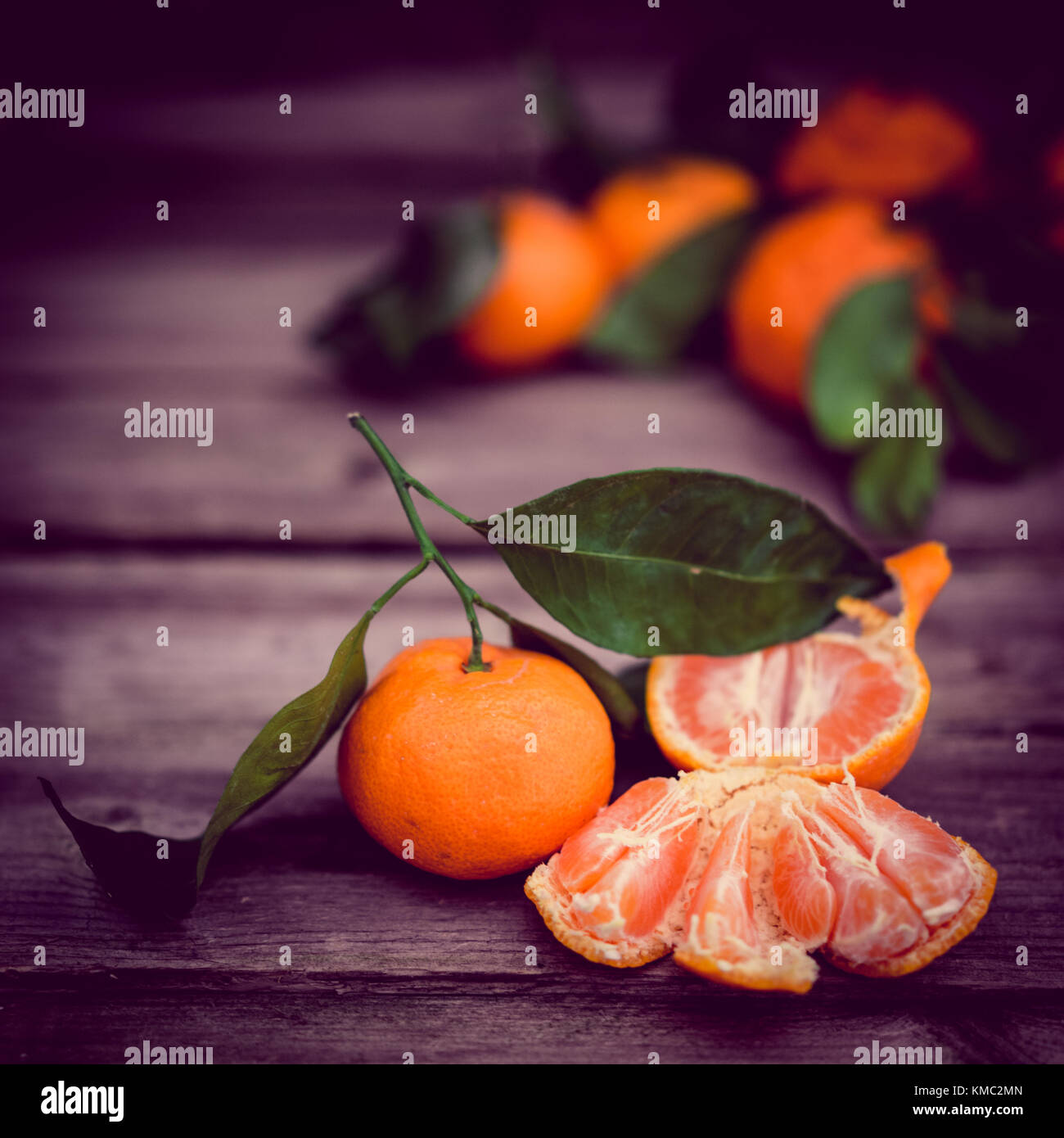 Tangerines on rustic background Stock Photo - Alamy