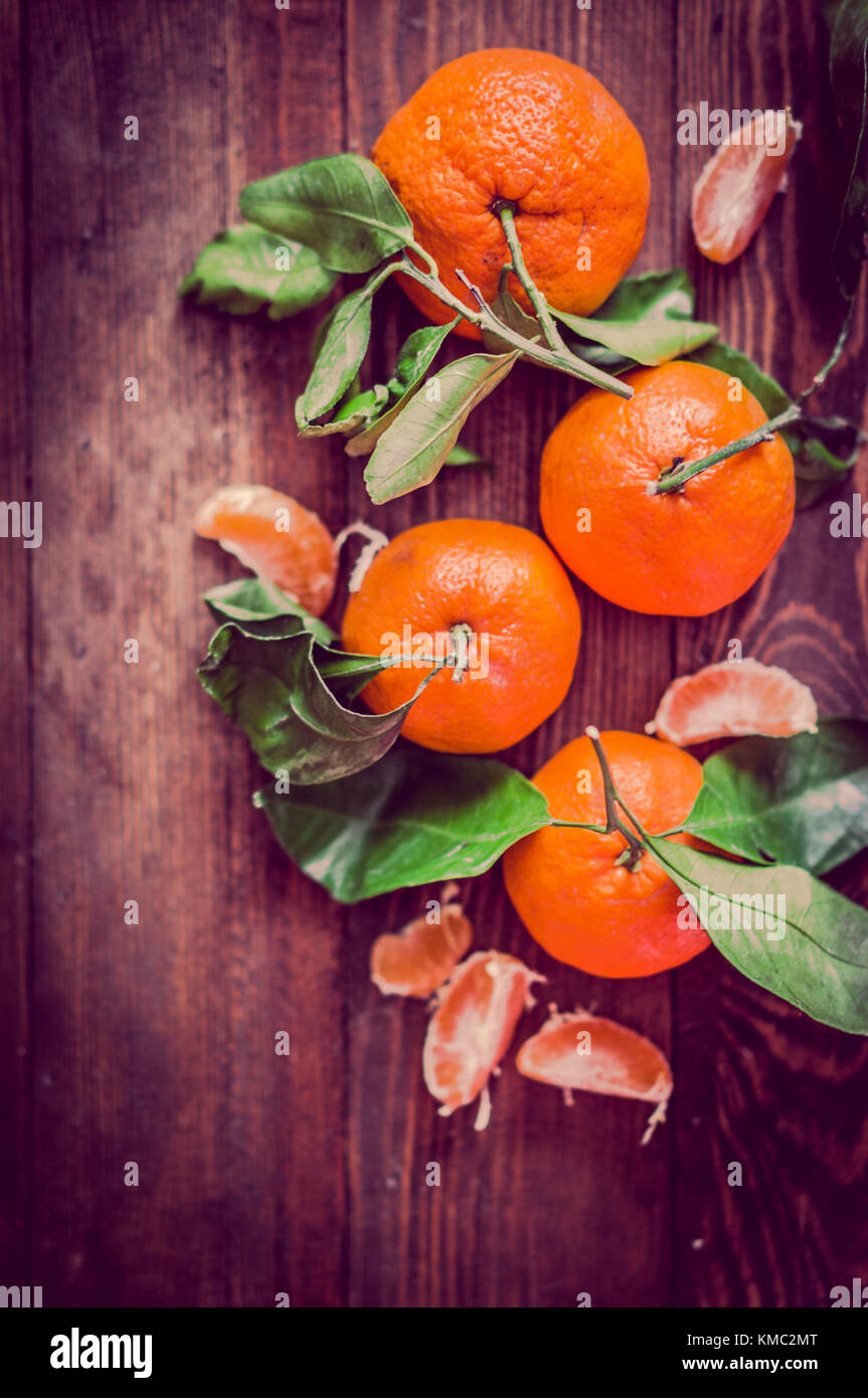 Tangerines on rustic background Stock Photo - Alamy