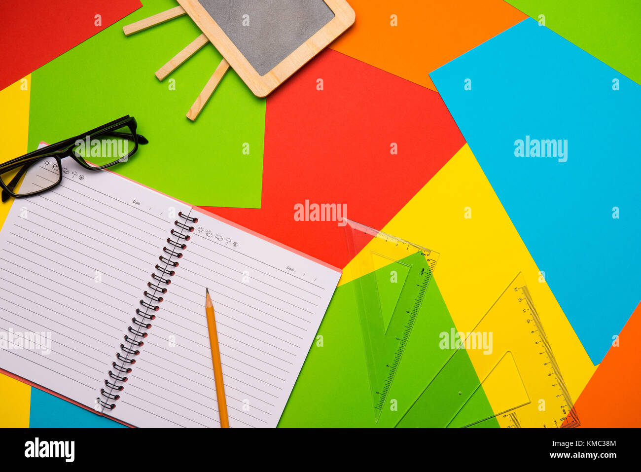 Blank white notebook on colorful paper background Stock Photo - Alamy
