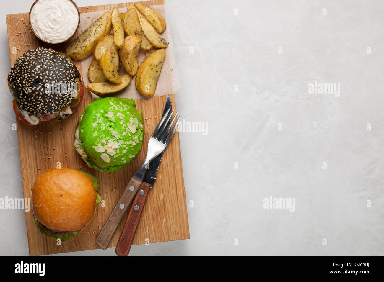 set of three mini homemade Burger with marble beef and vegetables on a ...