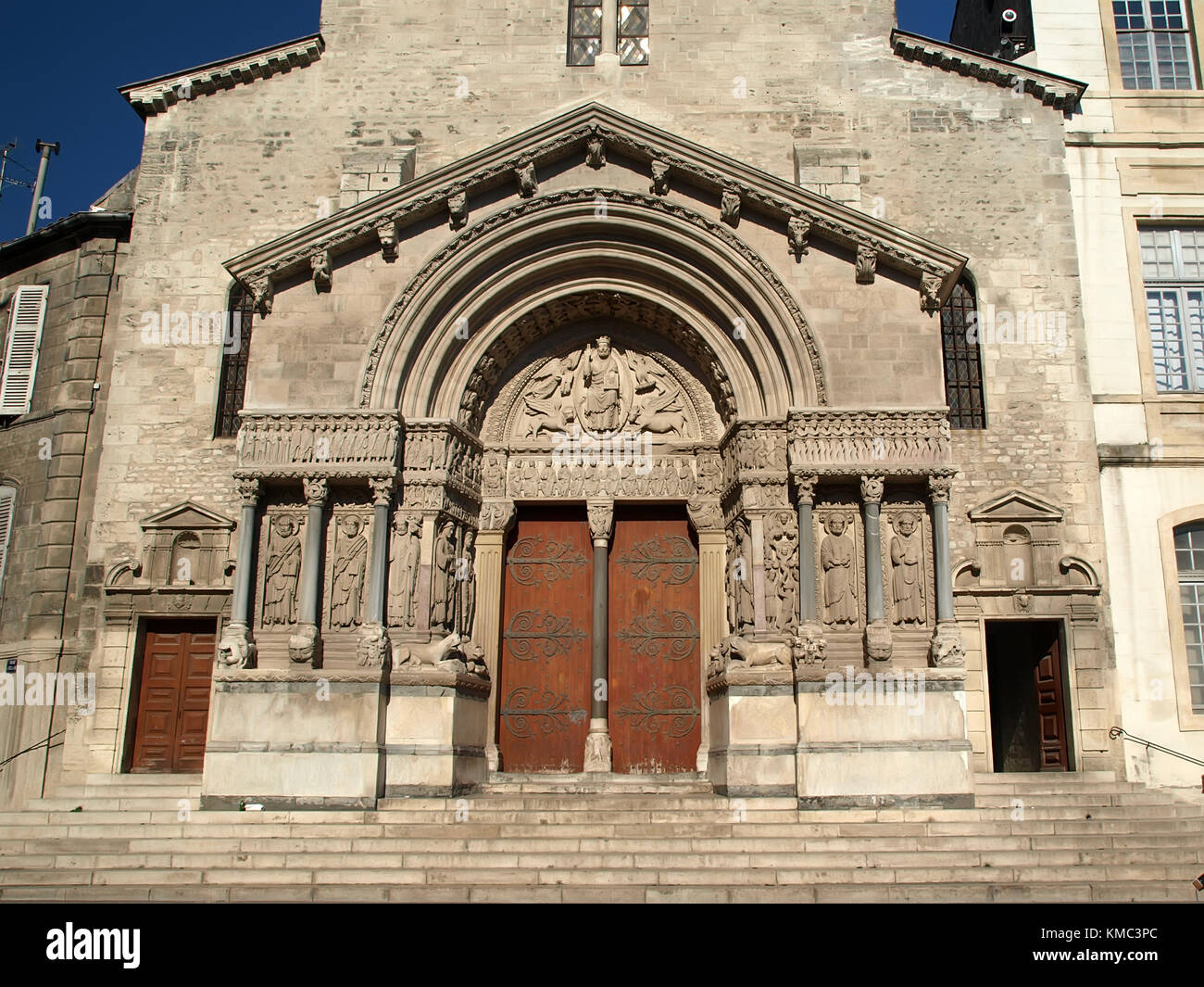 West facade of the Saint Trophime Cathedral in Arles, France. Bouches ...