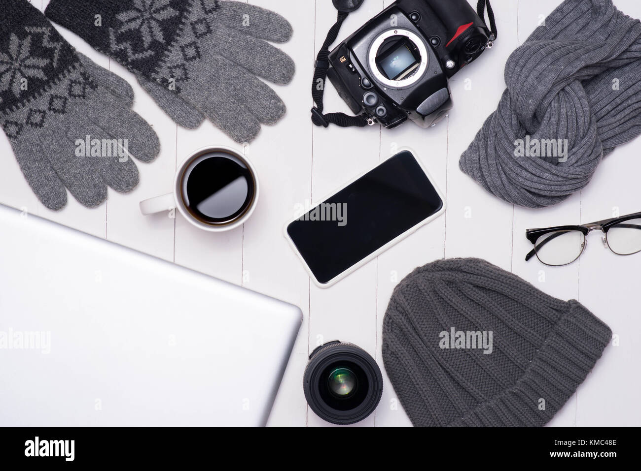 Men's winter casual outfits with camera, coffee cup, laptop, smartphone ...