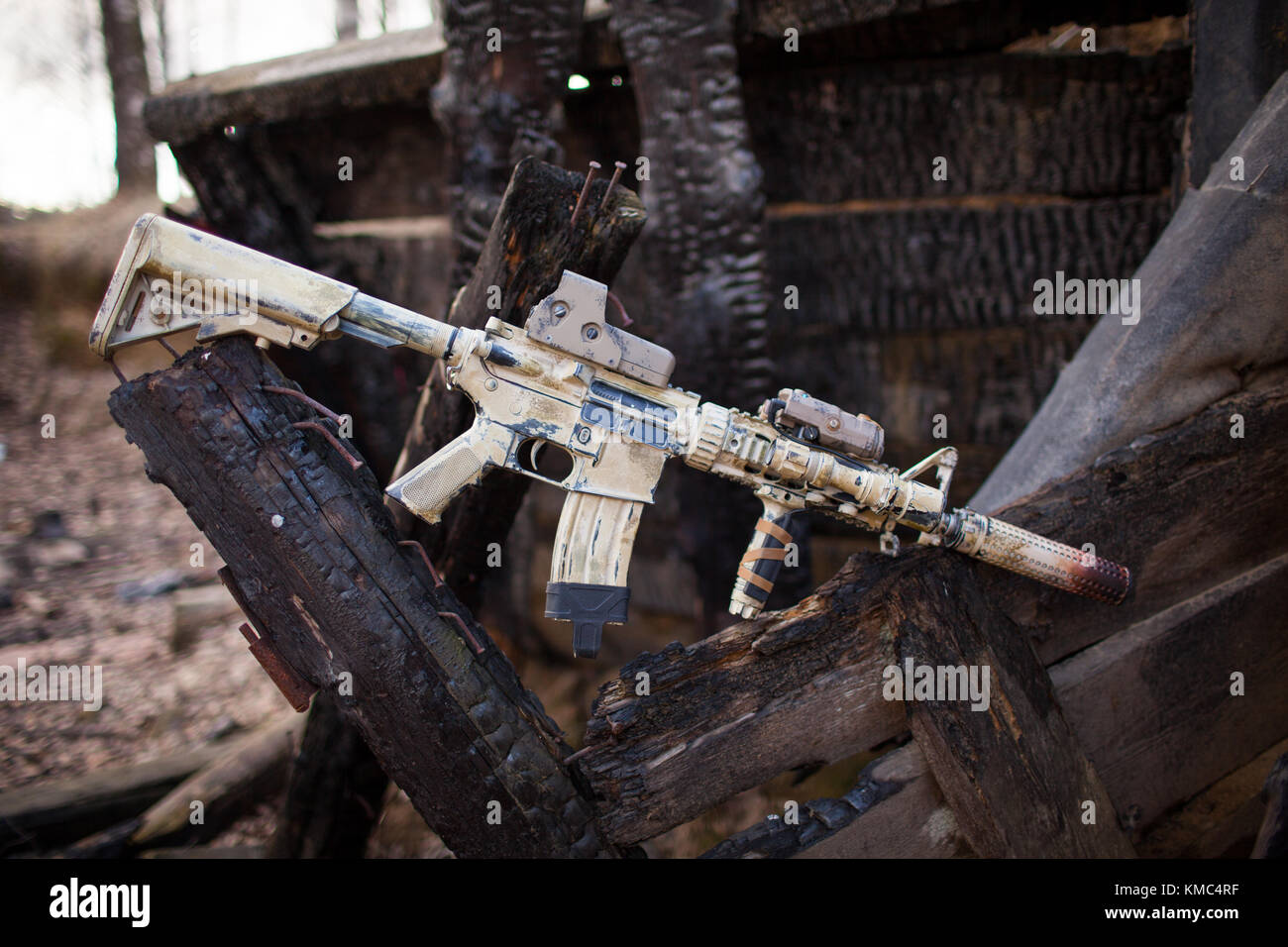 Assault Rifle, painted in sand color on the background of the burnt ...
