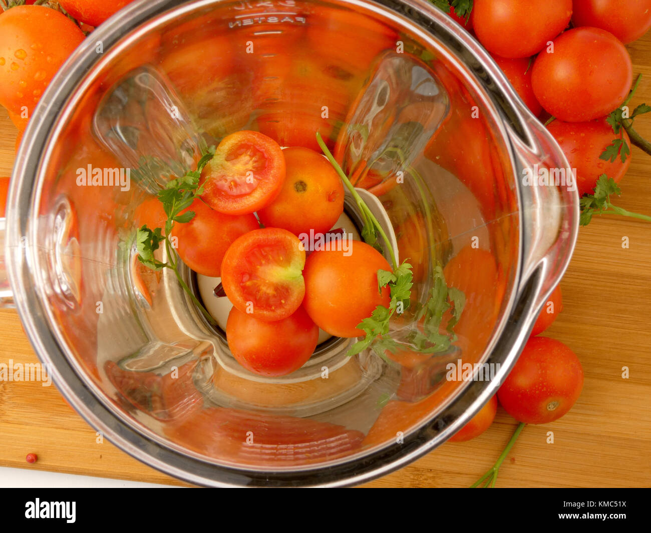 Cherry tomatoes in blender for making juice isolated Stock Photo - Alamy