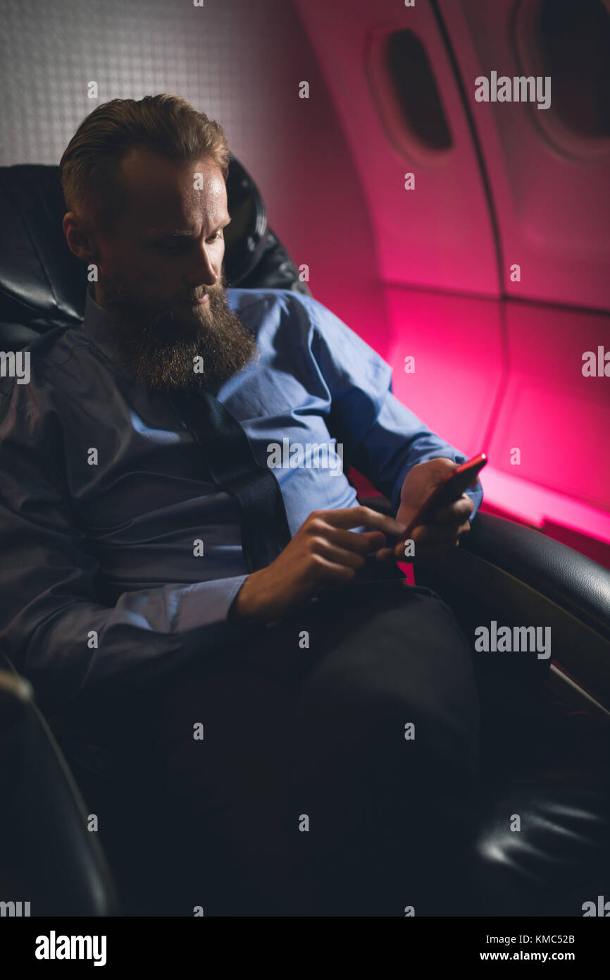 Airplane man phone hi-res stock photography and images - Alamy