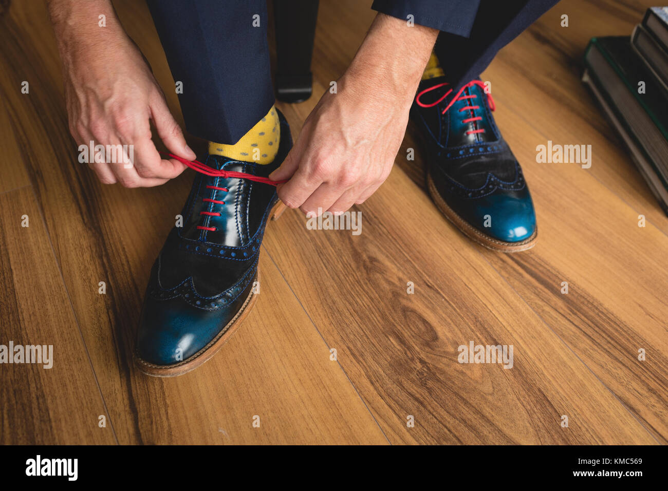 Man tying his shoe lace at home Stock Photo - Alamy