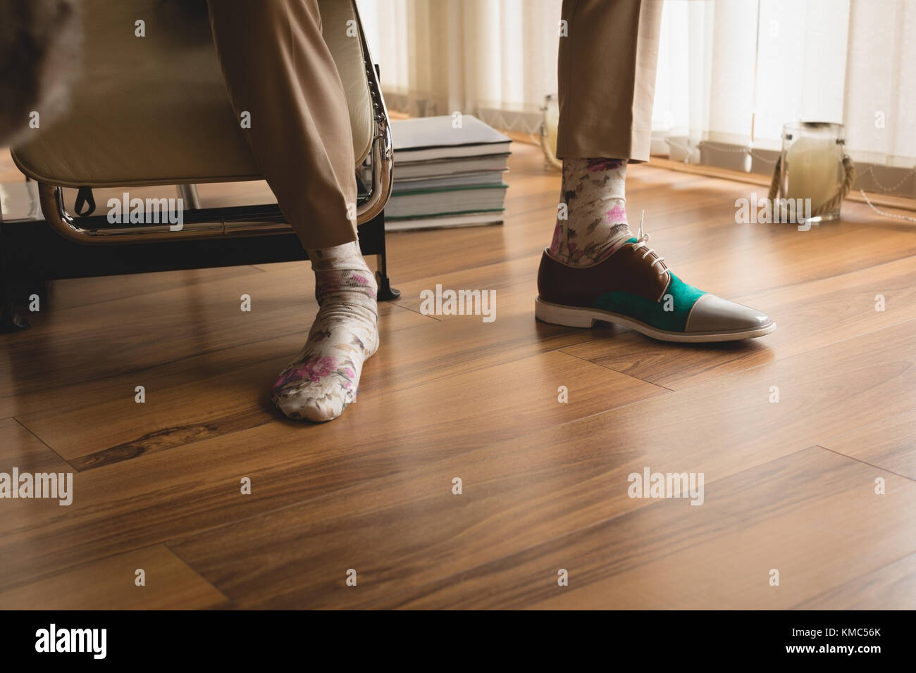 Man wearing his casual shoes in living room Stock Photo - Alamy