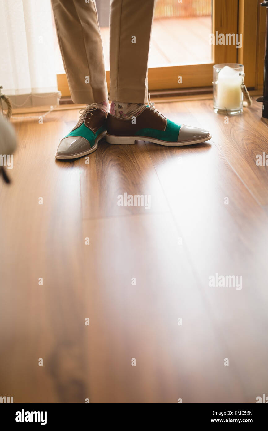 Man in casual shoes standing at home Stock Photo - Alamy