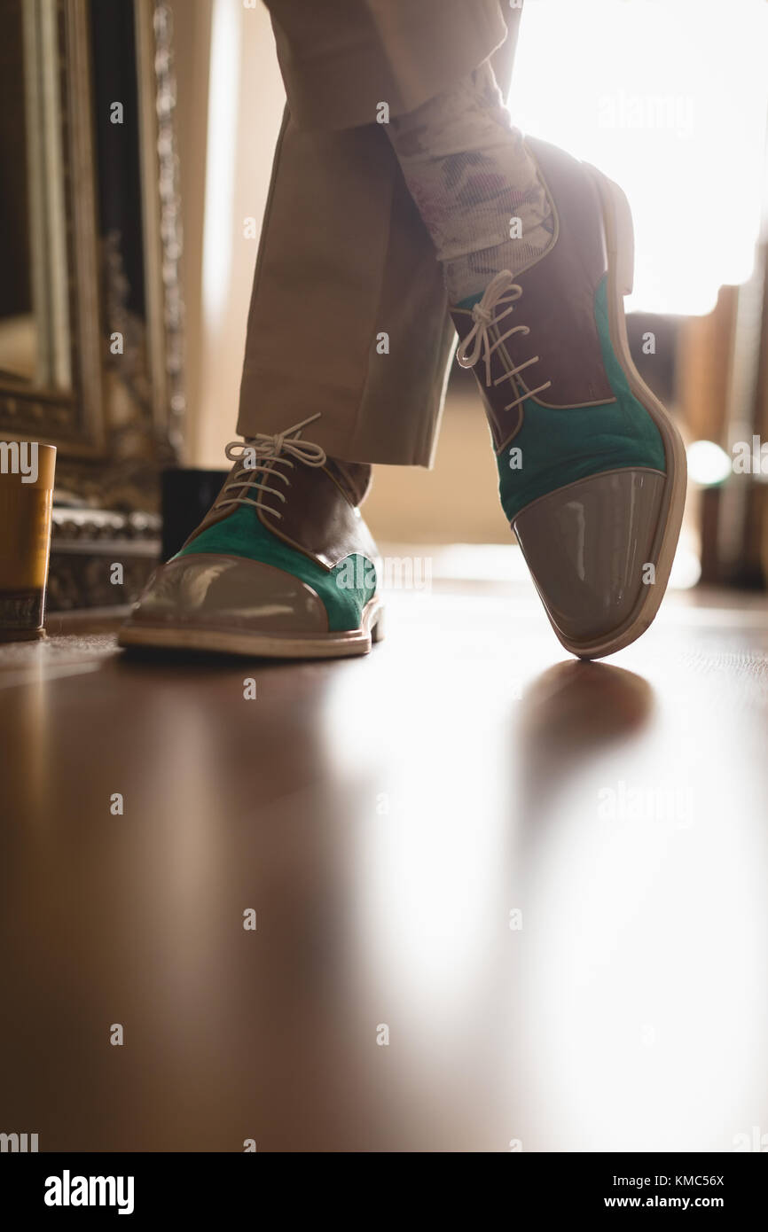 Man in casual shoes standing at home Stock Photo - Alamy