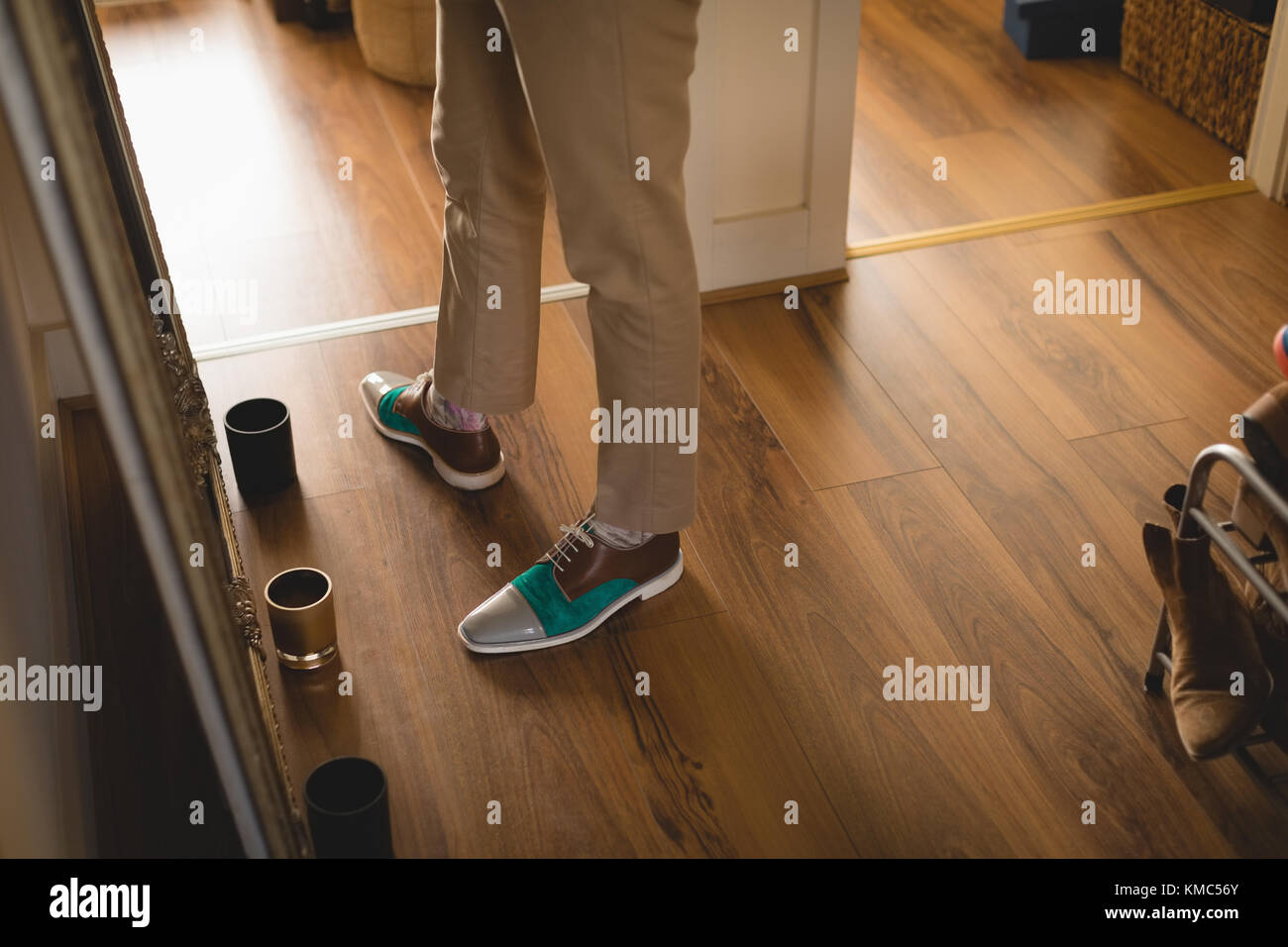 Man in casual shoes standing at home Stock Photo - Alamy