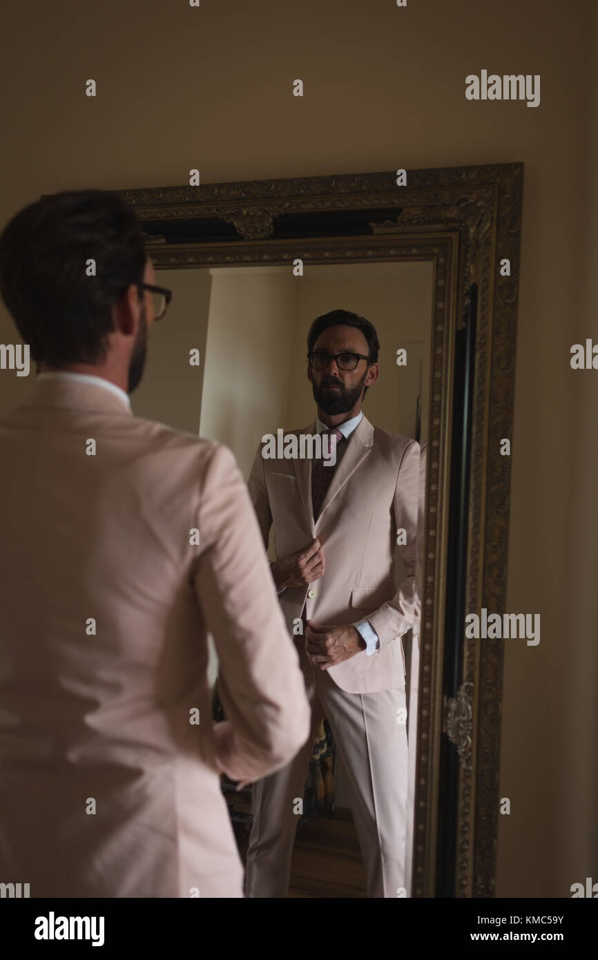 Man Looking In Mirror