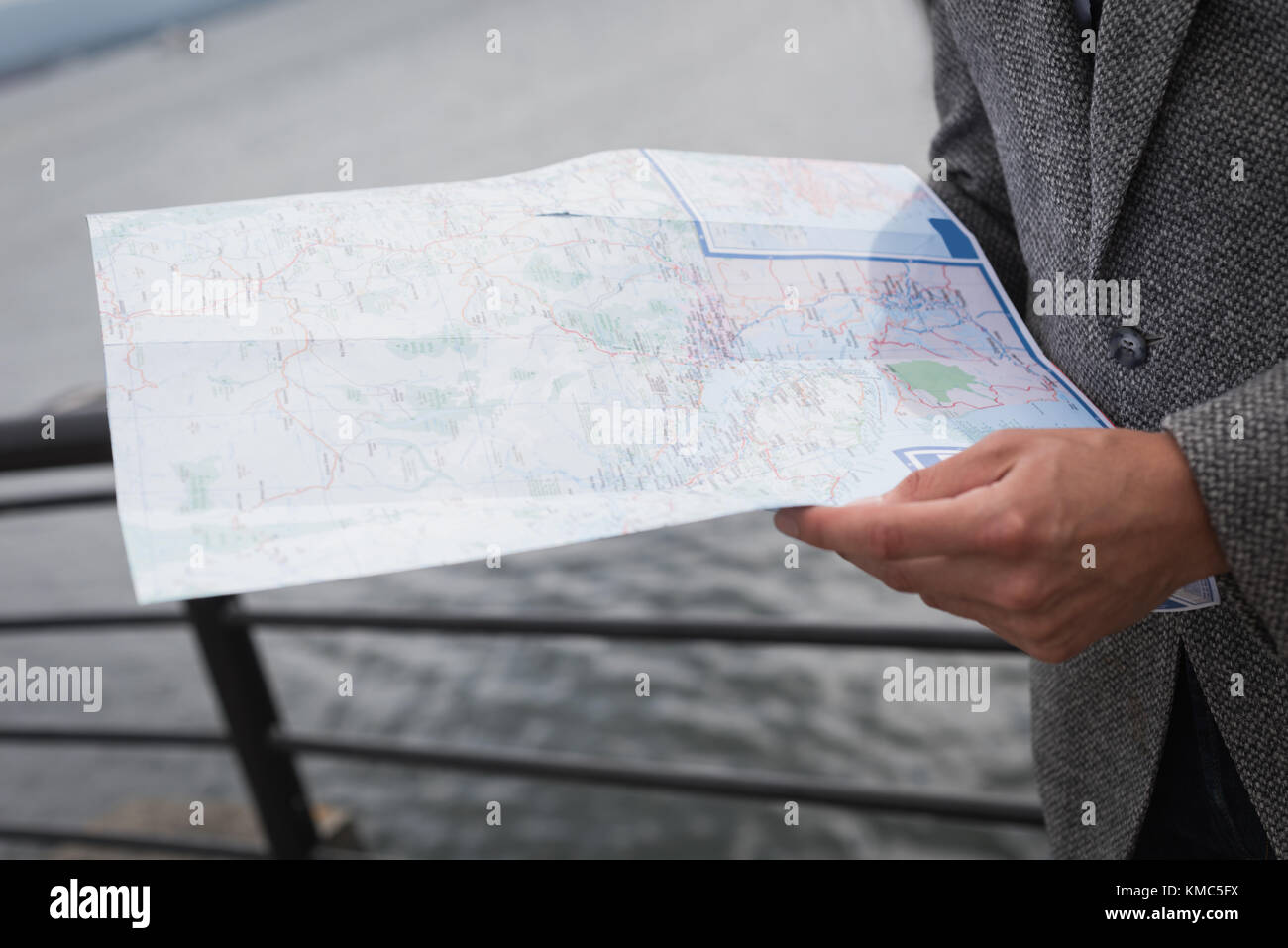 Holding map hi-res stock photography and images - Alamy