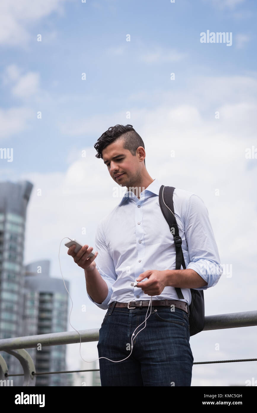 Male executive using mobile phone Stock Photo - Alamy