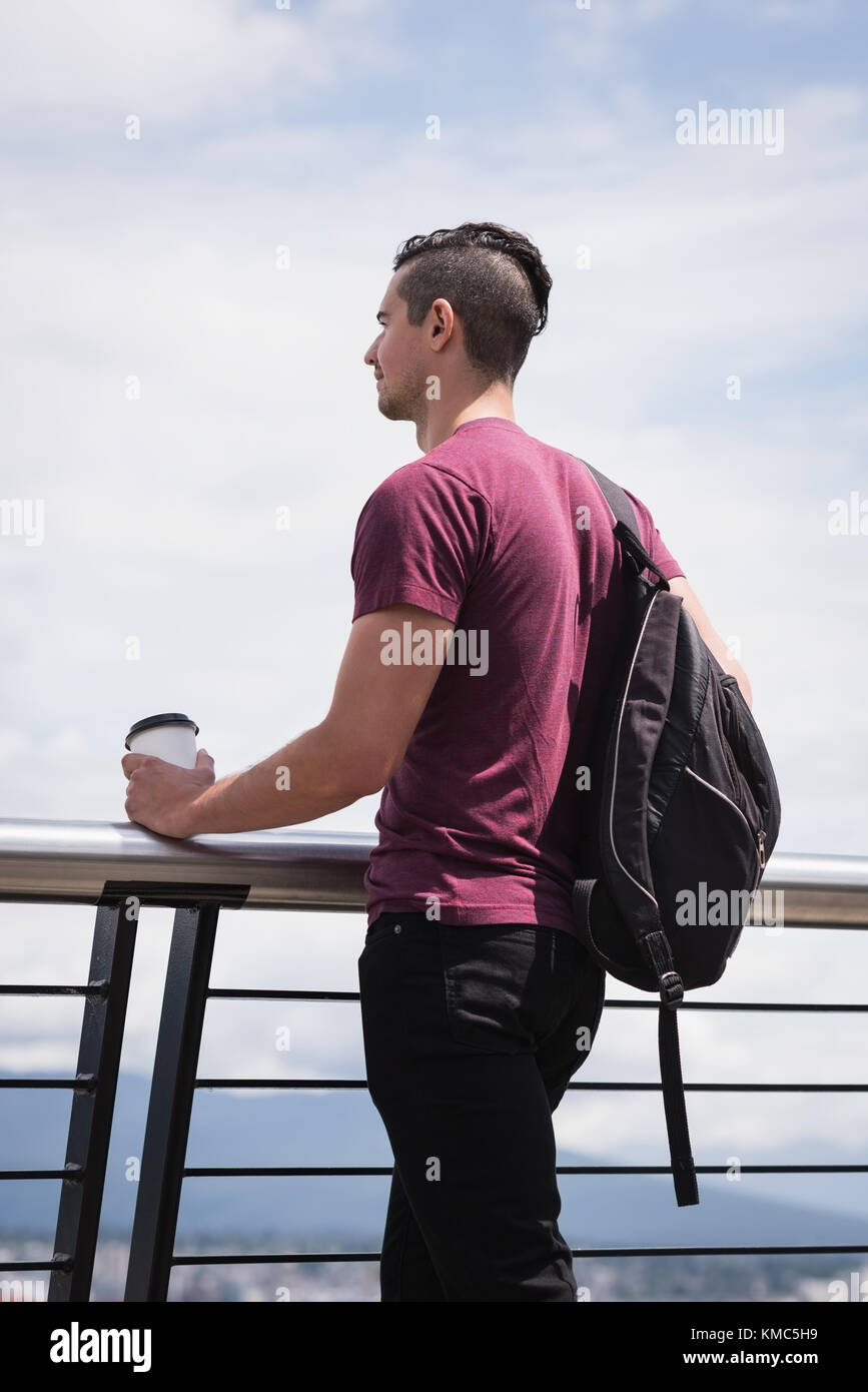 Handsome man backpack standing hi-res stock photography and images - Alamy
