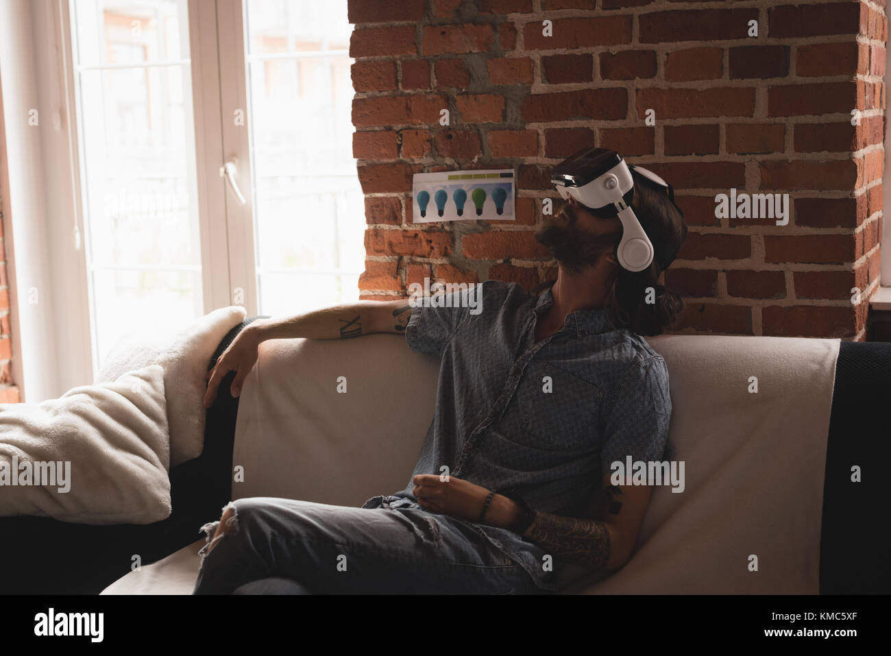 Man using virtual reality headset Stock Photo - Alamy