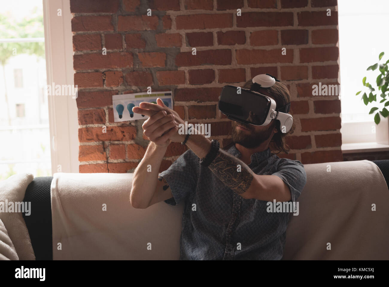 Man using virtual reality headset Stock Photo - Alamy