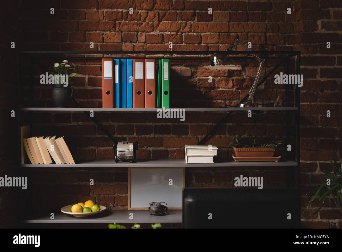 Files, folder and books kept on shelf Stock Photo - Alamy