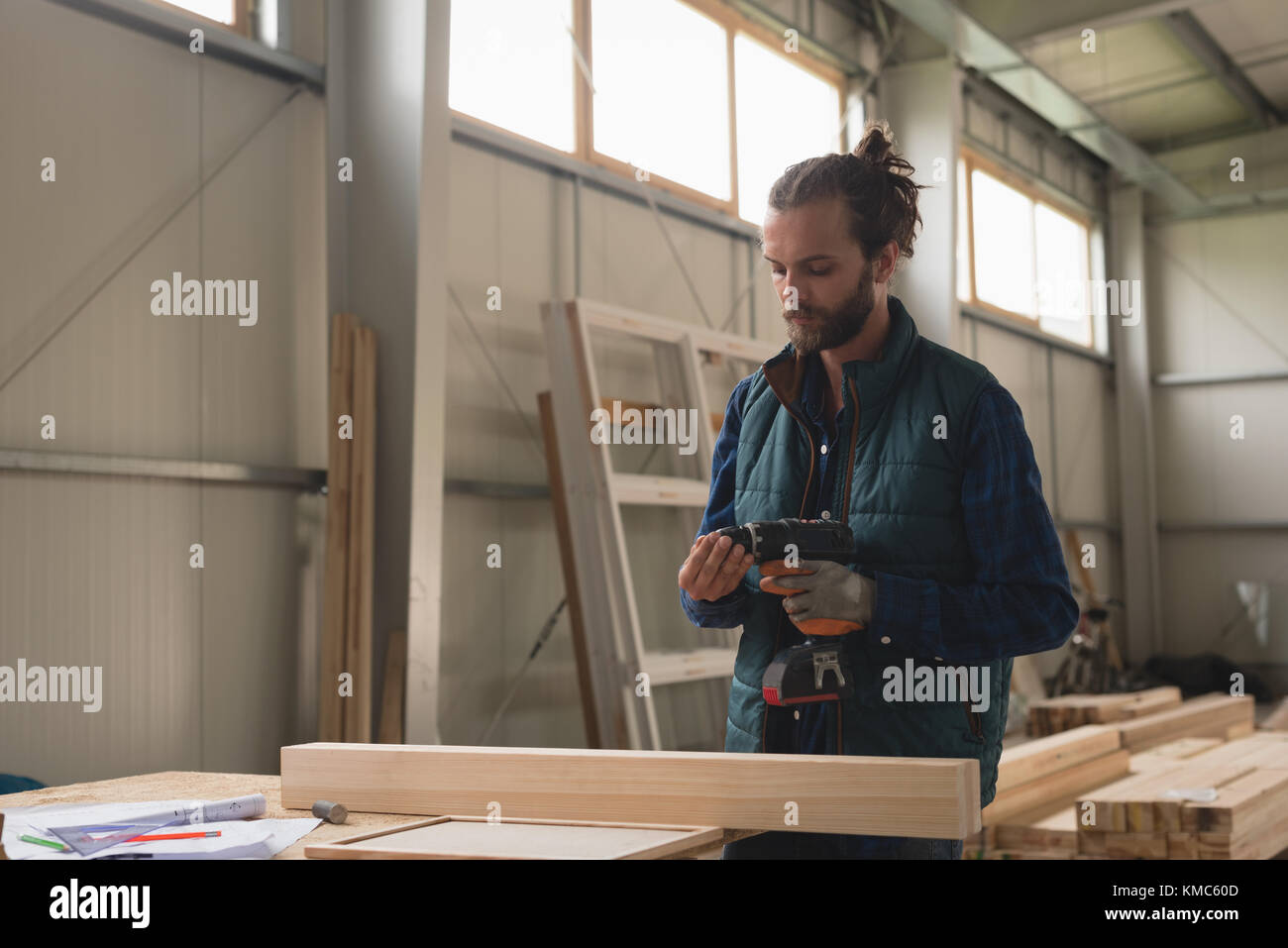 Carpenter working at table Stock Photo - Alamy