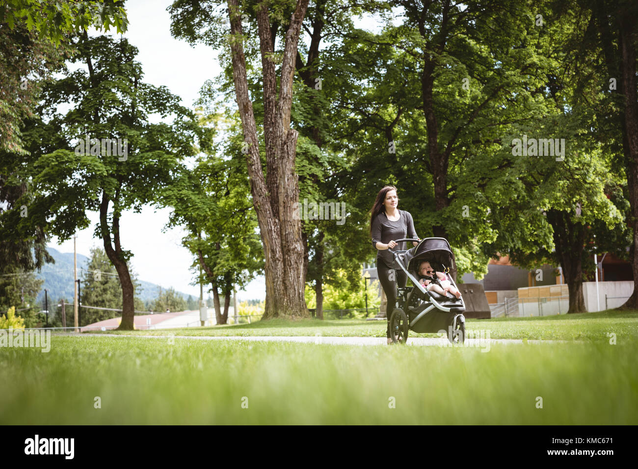 Mother carrying her baby in stroller Stock Photo - Alamy Mother carrying her baby in stroller Stock Photo - Alamy