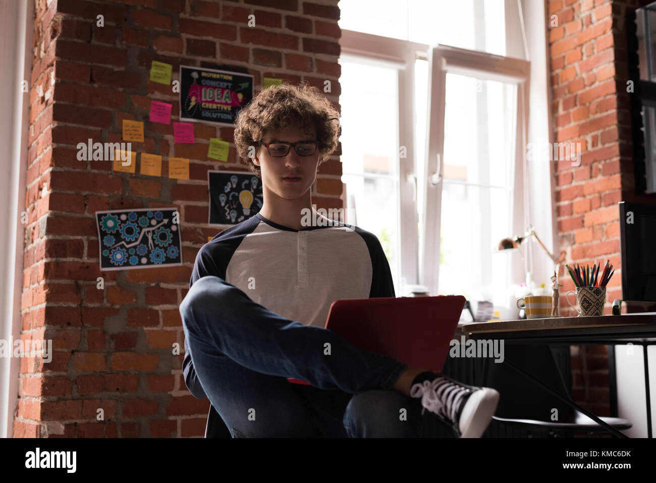 Male executive using laptop Stock Photo - Alamy