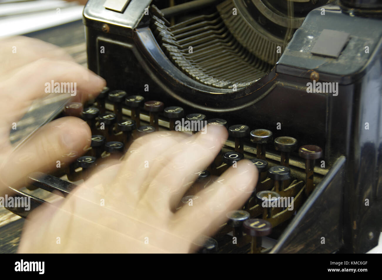 Fingers printed on old writing machine. Moved picture of the hands over ...